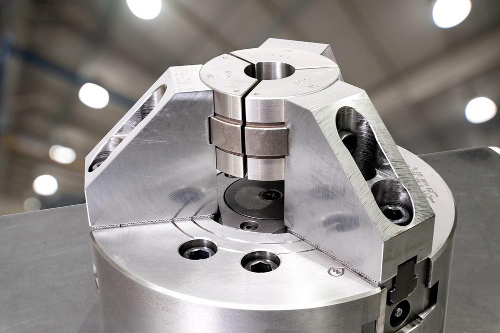 Carbinite coated collet pads and jaws better grip parts